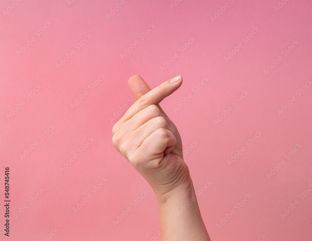 finger heart. Zoomers symbolize love. woman hand showing heart sign on ...