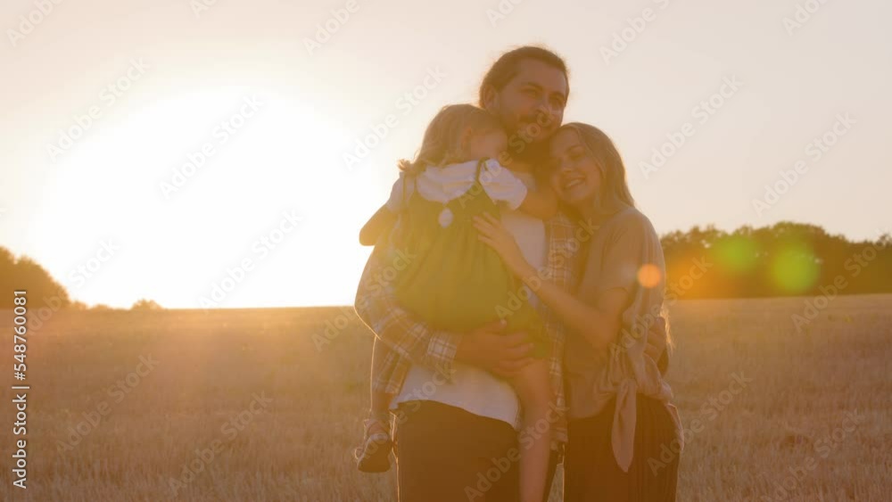 Family holidays weekend outdoors in park. Three silhouettes on sunset ...