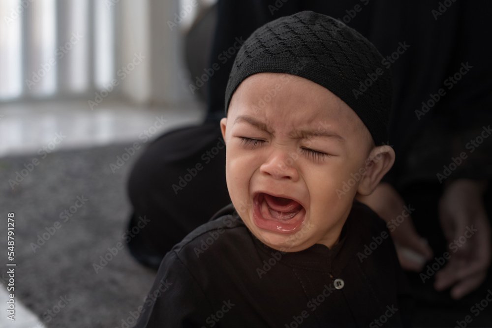 Close up, crying baby Muslim boy, Muslim boy wear black traditional ...