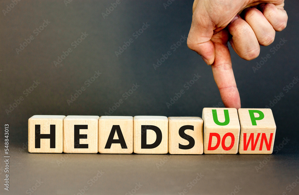 Heads up or down symbol. Concept words Heads up Heads down wooden cubes ...