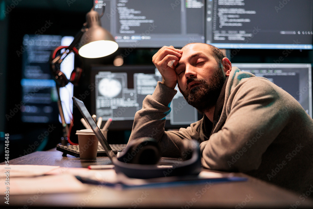 Exhausted app developer feeling sleepy late at night, falling asleep in ... Exhausted app developer feeling sleepy late at night, falling asleep in ...