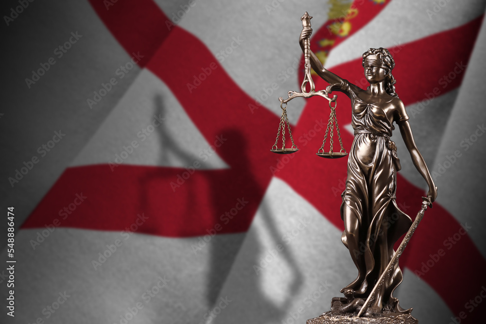 Jersey flag with statue of lady justice and judicial scales in dark ...