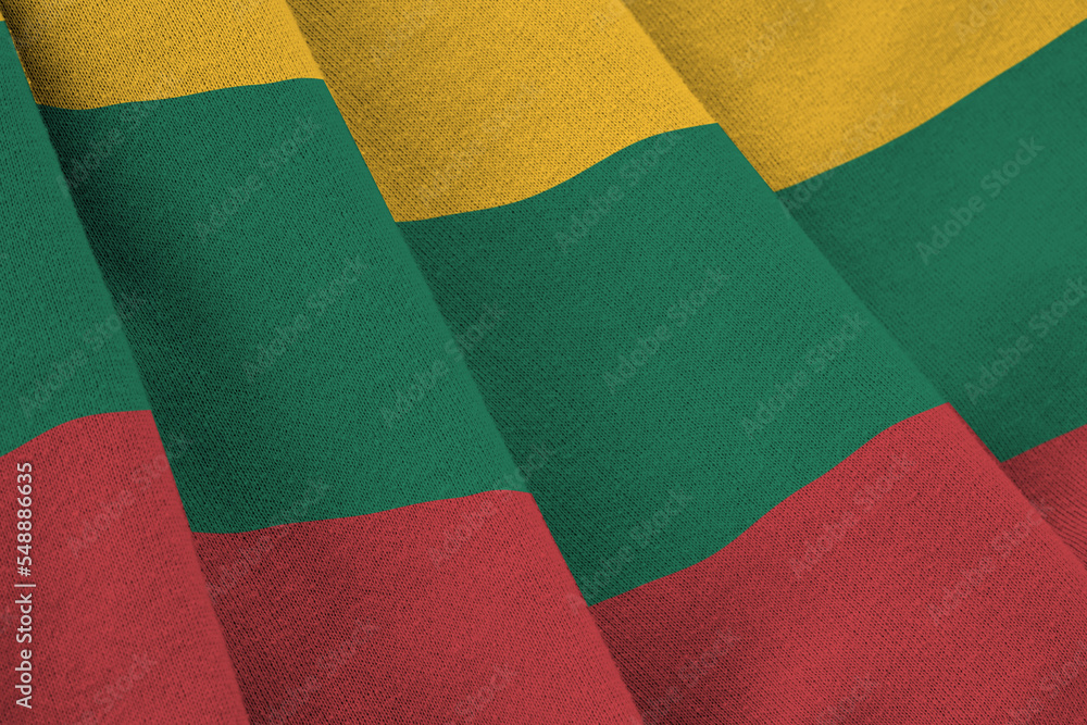 Lithuania flag with big folds waving close up under the studio light ...