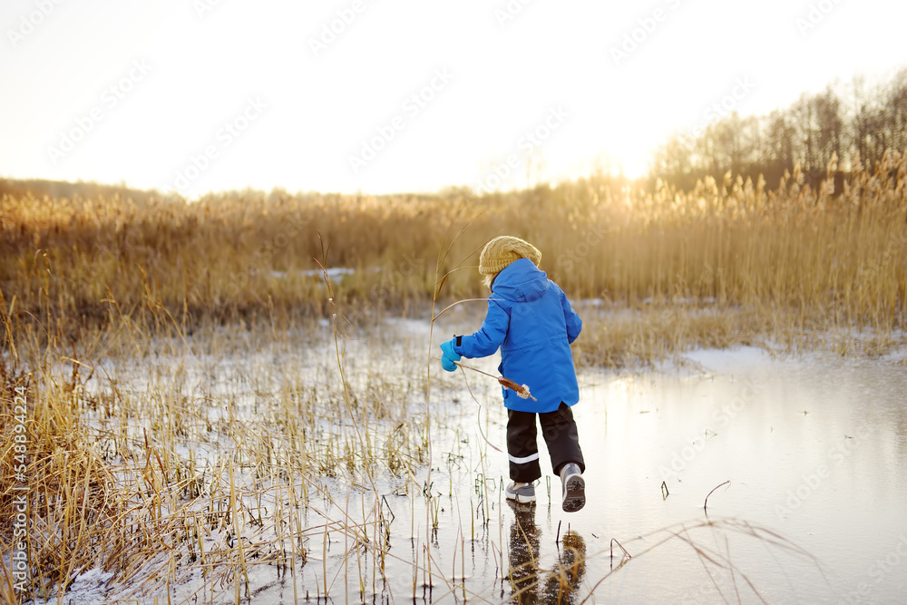 Boy Sliding On Ice