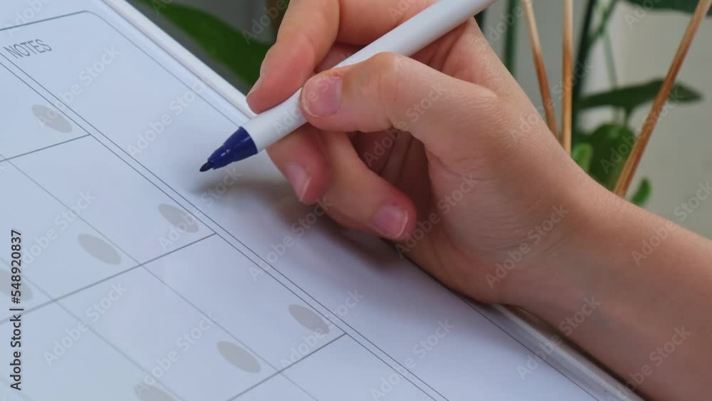 Female hand writing text YOUR COMFORT ZONE WILL KILL YOU with marker on ...