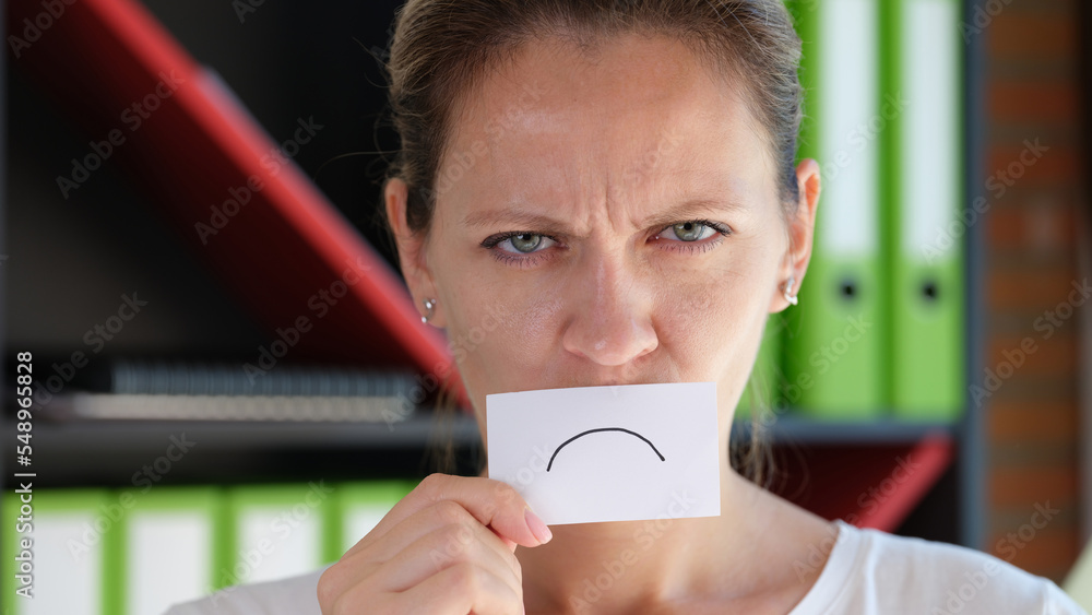 Grumpy woman covering face with paper unhappy emoticon symbol Stock ...