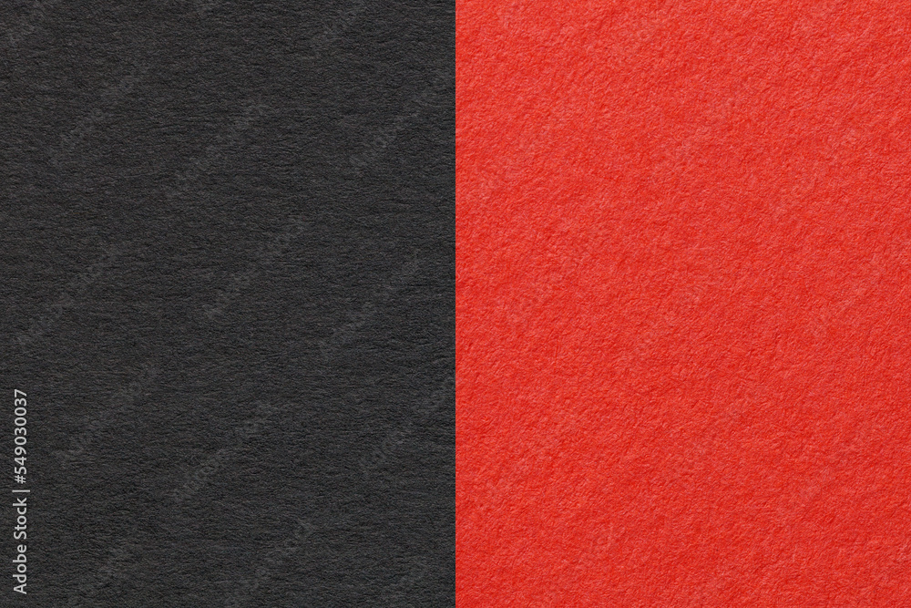 Texture of craft black and red paper background, half two colors, macro ...