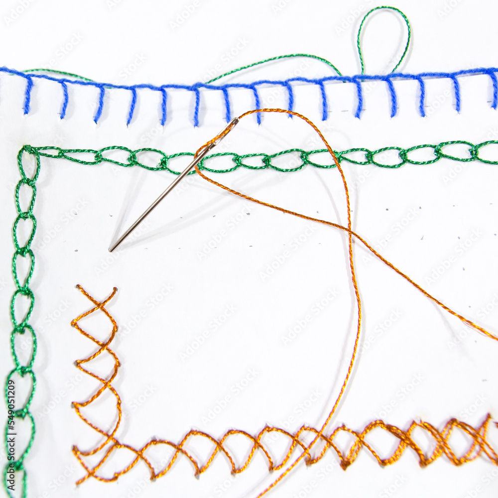 The closeup sewing process of making the colorful card during school ...