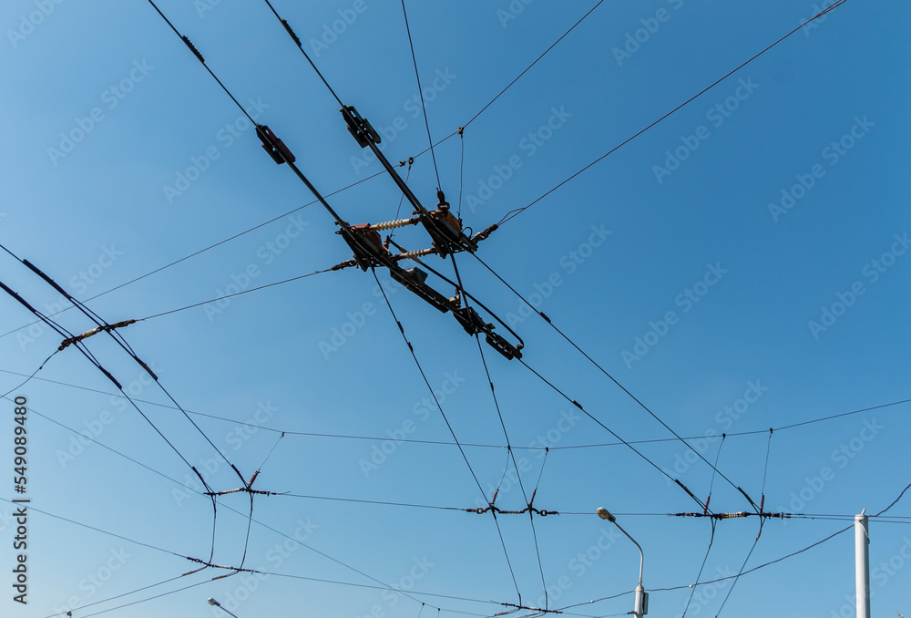 Trolleybus wires against the blue sky. Designed for the transmission of ...