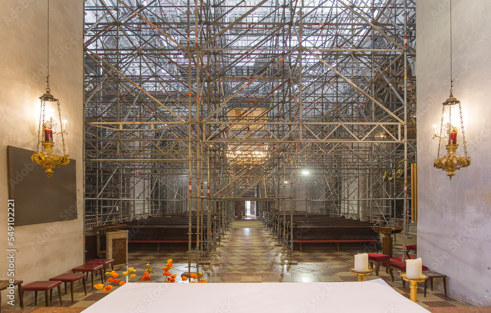 Construction site scaffolding in the interior. renovation of a church ...
