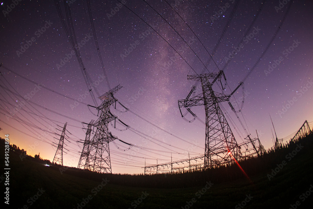 Poster pylon and the Milky Way, The high voltage substation is under ...