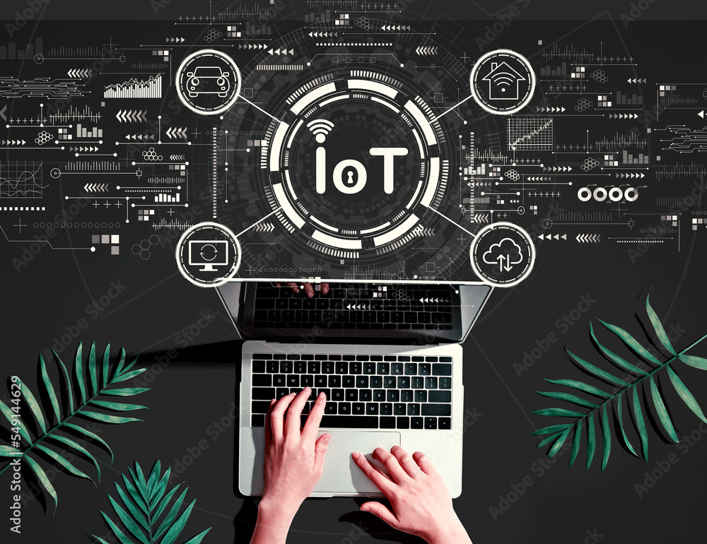 IoT theme with person using a laptop computer Stock Photo | Adobe Stock