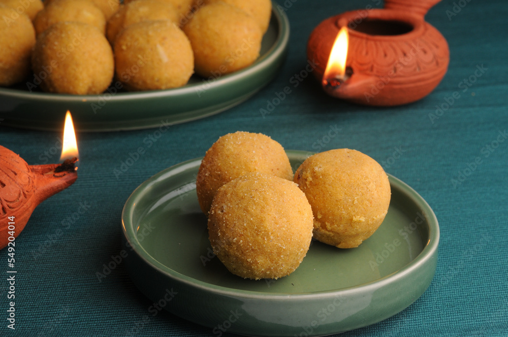 Besan ladoo, an Indian sweet dish made during festivals or celebrations ...