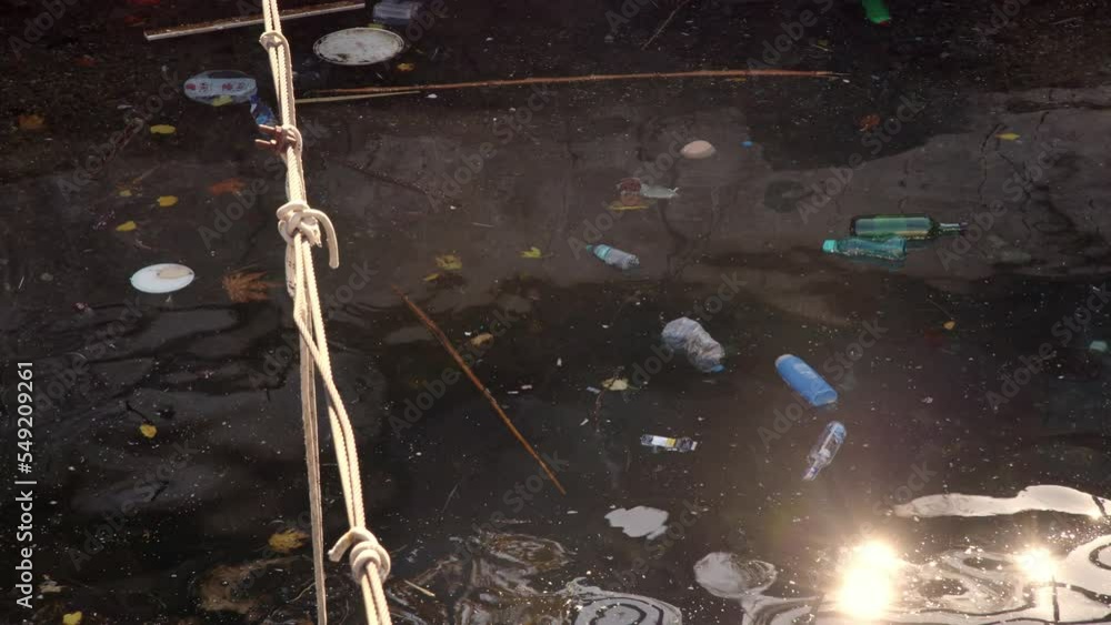 Floating debris in water pollute environment. Beautiful footage with ...