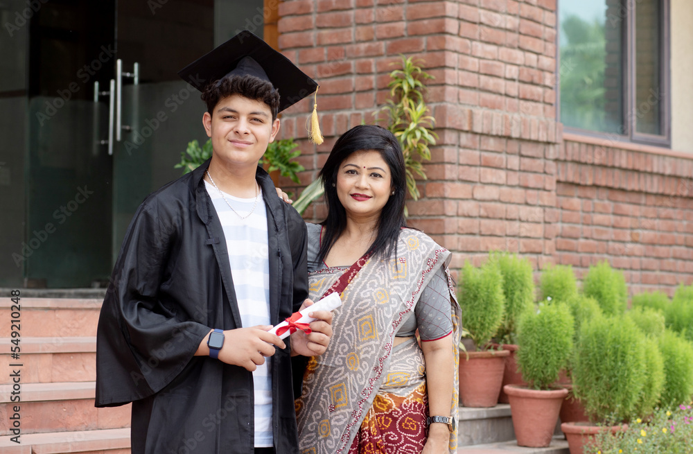 Happy Indian university male student and proud mother celebrating ...