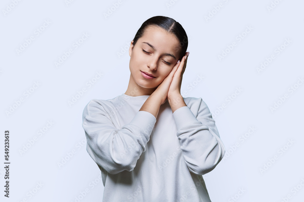 Young woman sleeping with closed eyes, on white studio background Stock ...