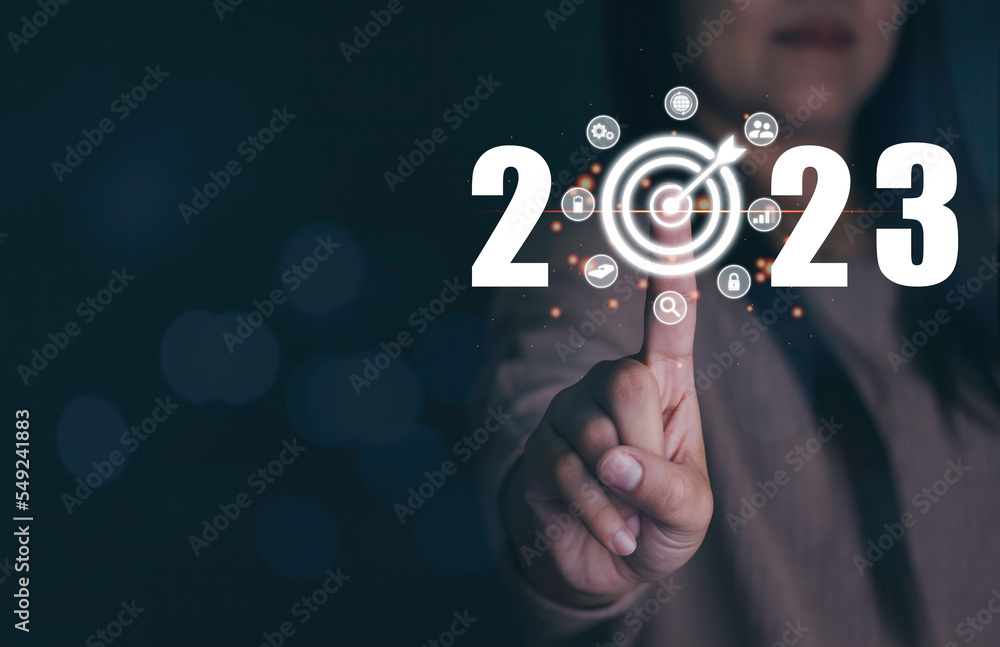 Businesswoman's finger pressing starting up 2023 button on virtual ...