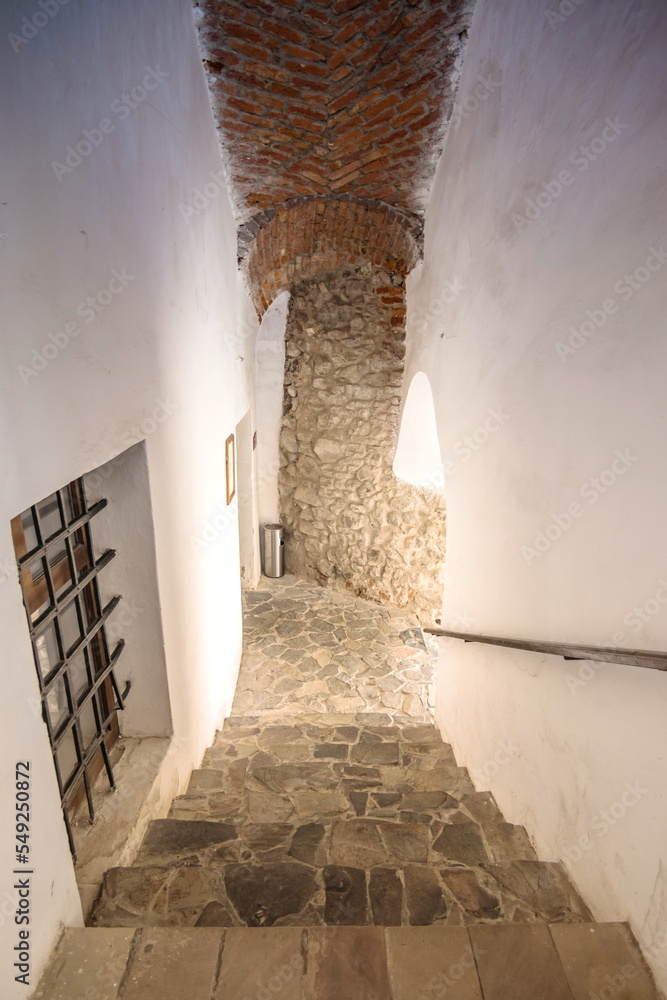 Passage between two parts of the ancient castle with an old stone ...