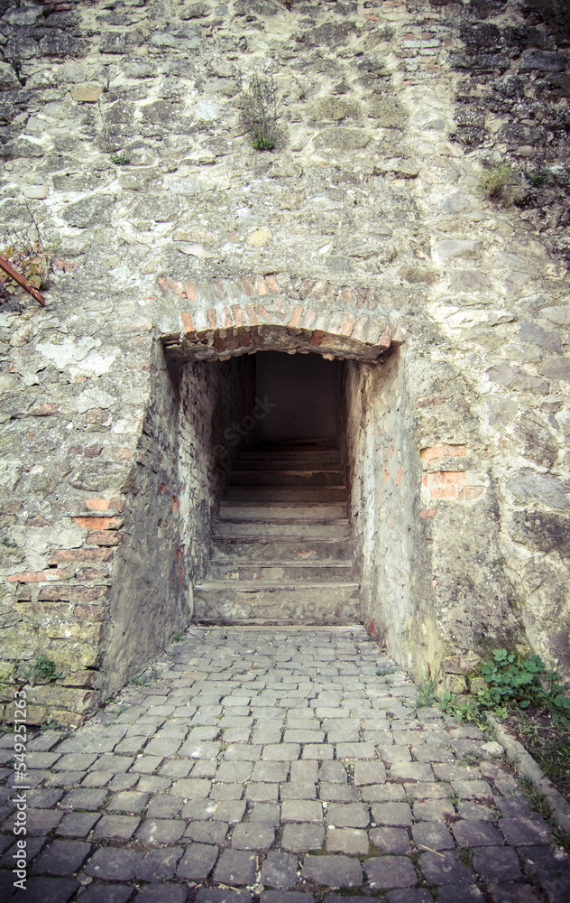 Passage between two parts of the ancient castle with an old stone ...
