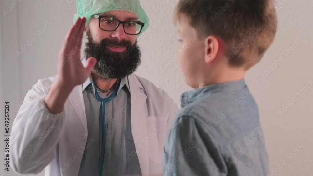 male doctor pediatrician with gadget in professional medical uniform ...