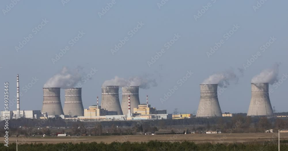 view of a nuclear power plant. View of smoking chimneys of nuclear ...
