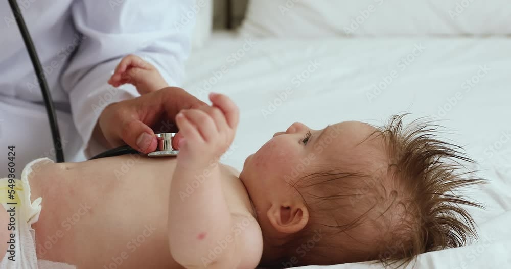 Kids doctor examining little infant patient, listening breath ...