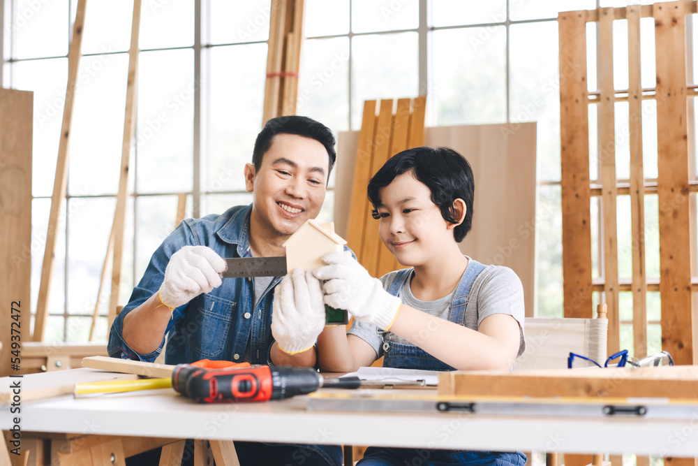 Southeast asian family father and son diy or repair for crafts skill at ...