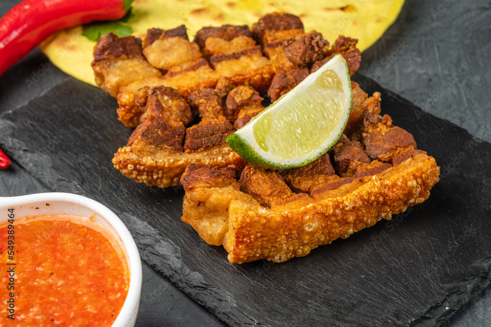 Chicharron is a traditional appetizer of baked pork belly with crispy ...