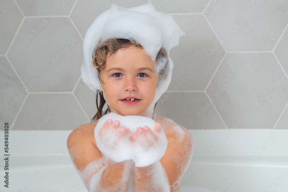 Kids shampoo. Boy child in a bath with foam. Kids bathing and hygiene ...