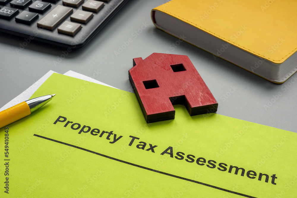 Property tax assessment papers and model of house. Stock Photo | Adobe ...