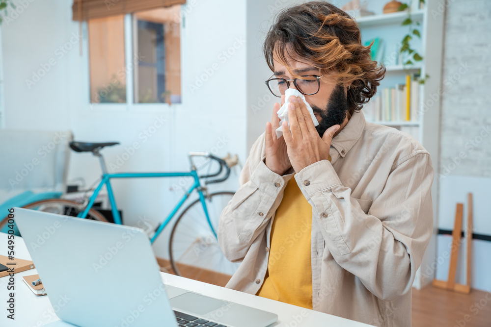 Ill at work young man got flu allergy sneezing blowing wiping running ...
