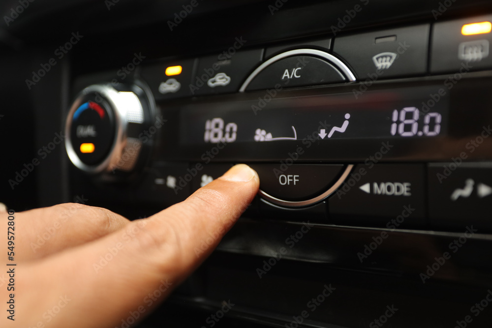 driver presses off button to turn off ac on luxury car dashboard Stock ...