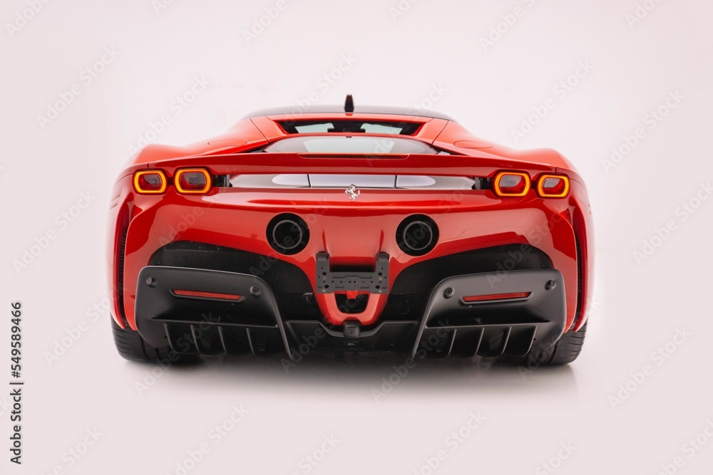 Rear end of a red Ferrari SF90 Stradale in a studio, on white ...