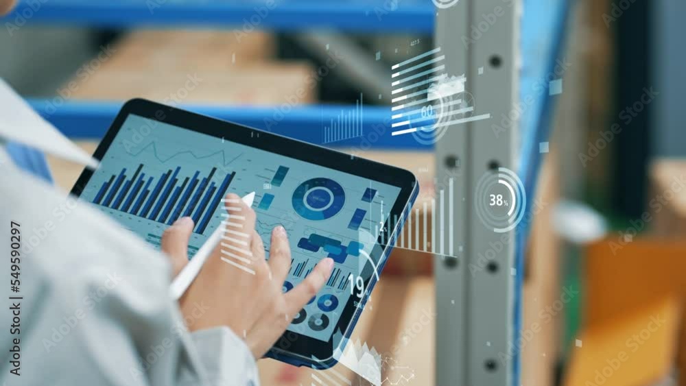 Worker using tablet PC and statistical data. Inventory control ...