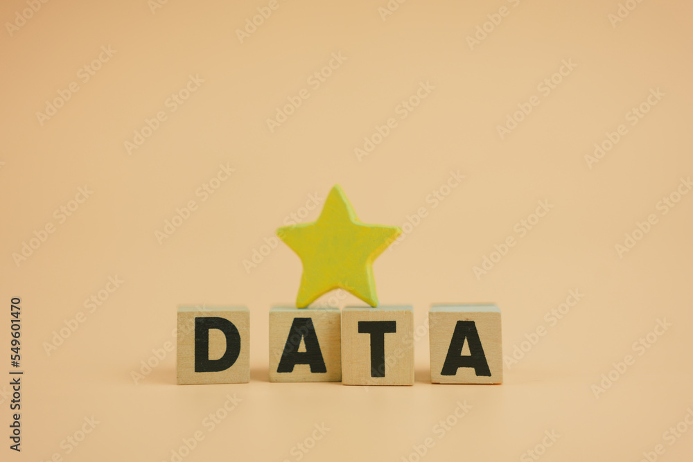 DATA words is written on wooden cubes and yellow star. Data is ...