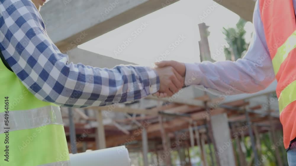 Engineers check hand to complete the deal and progress is according to ...