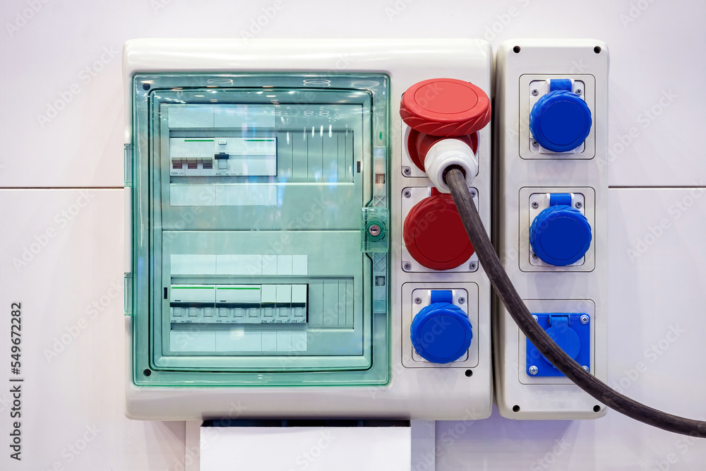 Electrical box on wall. Hinged switchboard with high voltage cable ...