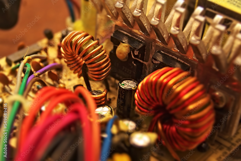 computer power supply board, top view. Capacitors, inductors, diodes ...