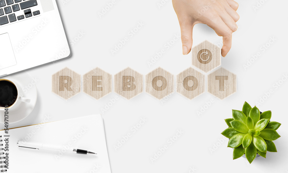 Reboot - Wood grain hexagon with text Reboot and hand-holding hexagonal ...