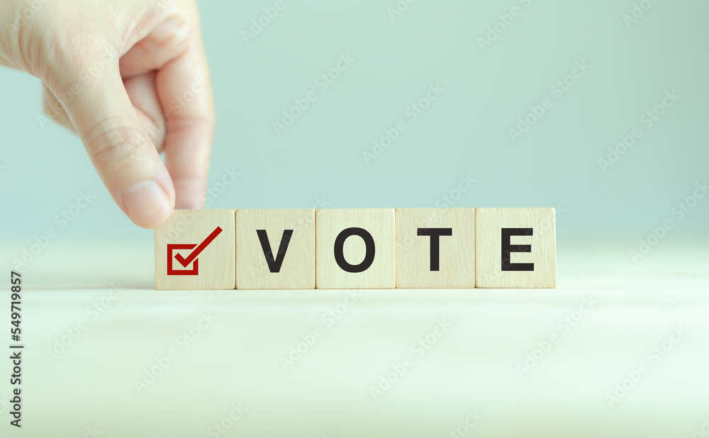Election vote concept. Vote word with checkmark symbol on wooden cube ...