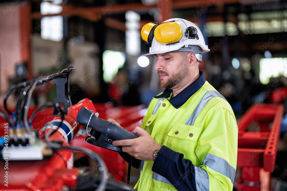 Engineer use remote control check hardware robotic arm at Industry ...