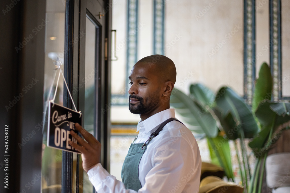 African American store owner opening for business Stock Photo | Adobe Stock