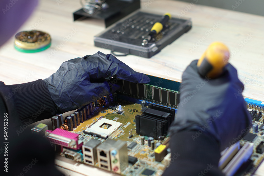 inserting ram into motherboard from computer on table Stock Photo ... inserting ram into motherboard from computer on table Stock Photo ...