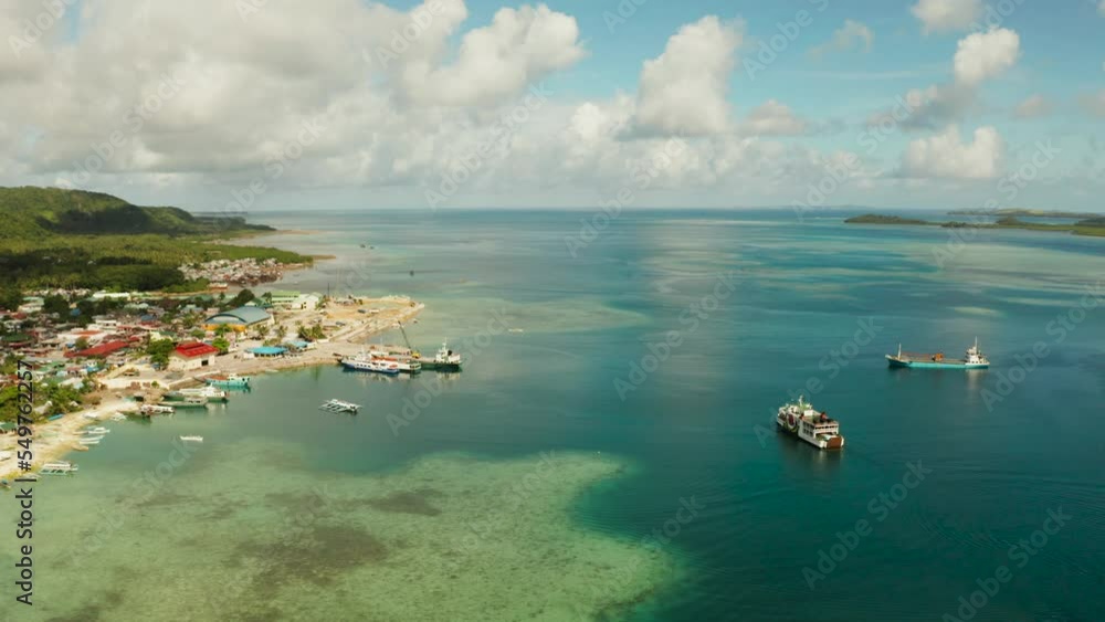 Freight ships and ferries in the bay, top view. Dapa Ferry Terminal ...