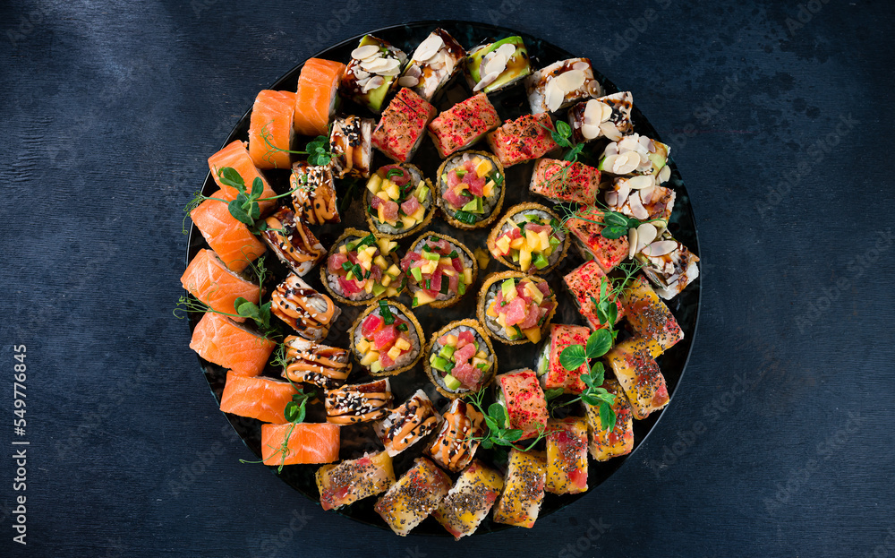 Big set of japanese sushi rolls with tuna, sea bass, salmon, cucumber ...
