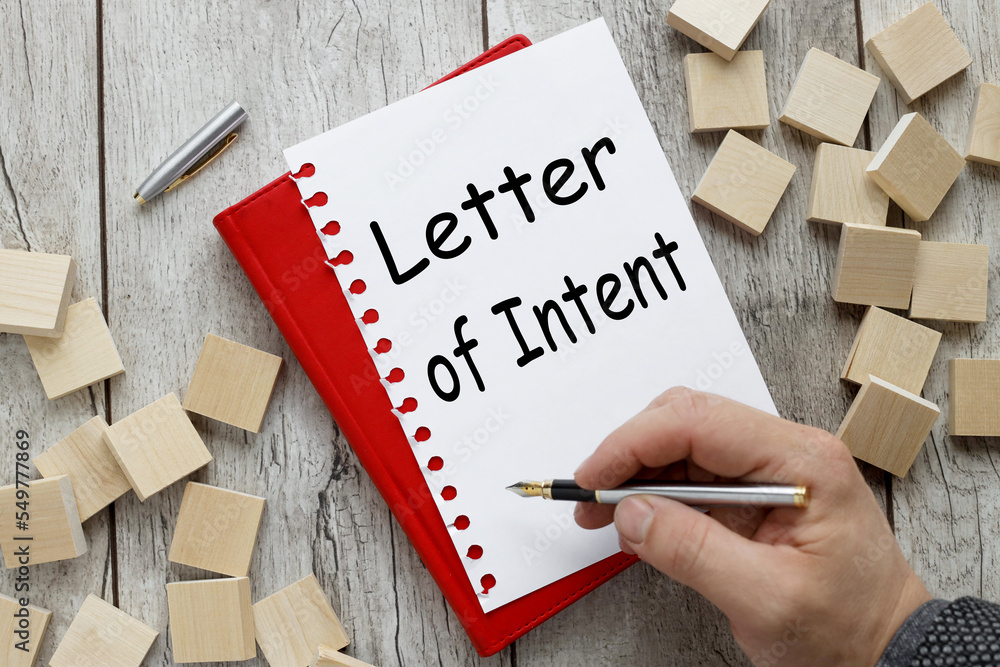 Letter of Intent. text on a torn page inscription by a man's hand Stock ...