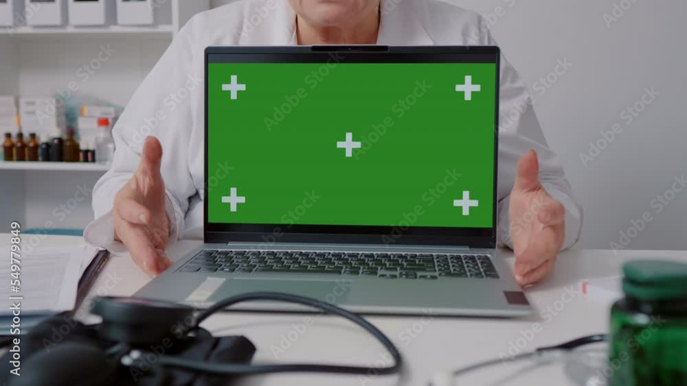 Close up of green screen laptop mockup doctor explaining in white gown ...
