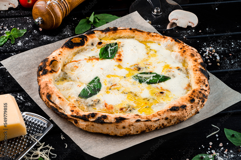 Fresh Italian pizza with different types of cheese parmesan, blue ...