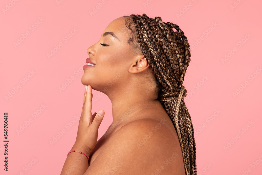 Facial treatment. Profile portrait of black obese woman with perfect ...
