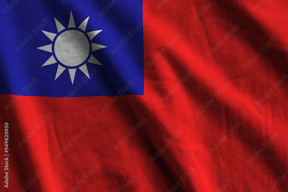 Taiwan flag with big folds waving close up under the studio light ...
